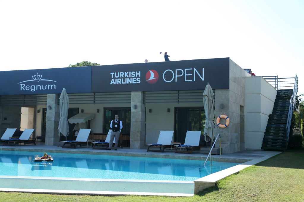 16th hole at Turkish Airlines Open tees-off over pool