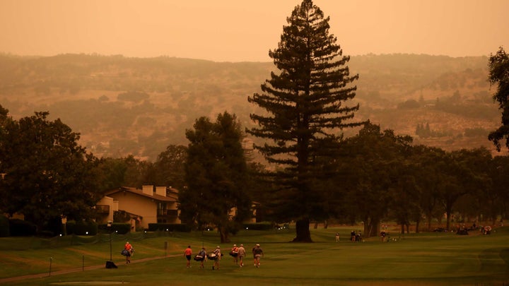 California fires, smoke leave eerie haze over Safeway Open