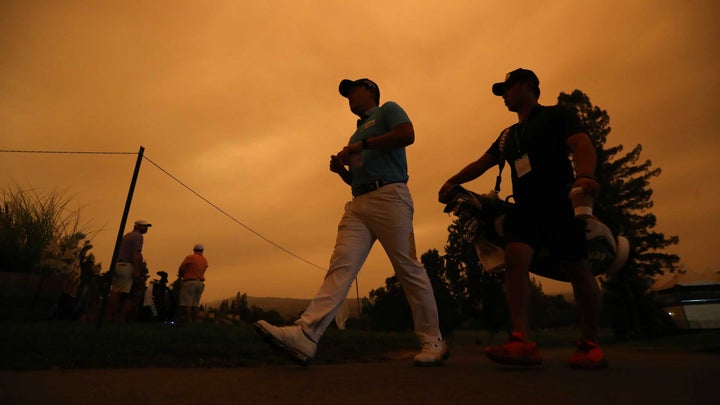 California fires, smoke leave eerie haze over Safeway Open