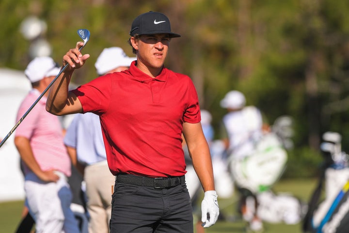 Golfers are showing support for Tiger Woods by wearing red and black