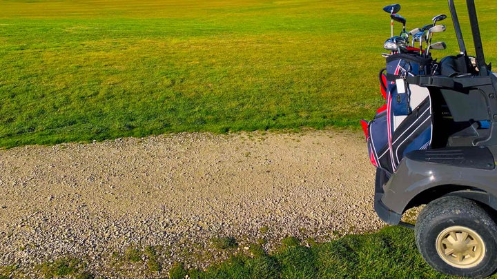Are you allowed to stand on the cart path after taking relief from it?