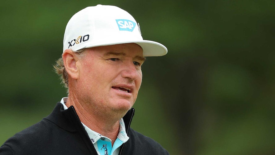 Ernie Els hits a ‘don’t try that at home’ shot from behind a tree