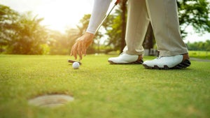 Is straddling the line of your putt legal if you lift one of your feet?