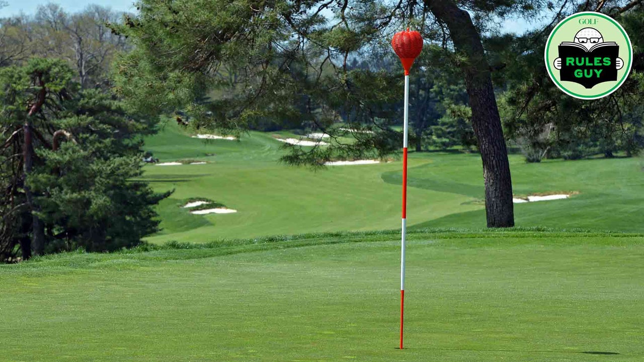 How do you proceed if your ball gets caught in the flagstick?