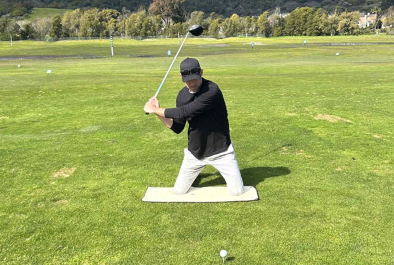 How hitting a driver while kneeling can clean up your swing