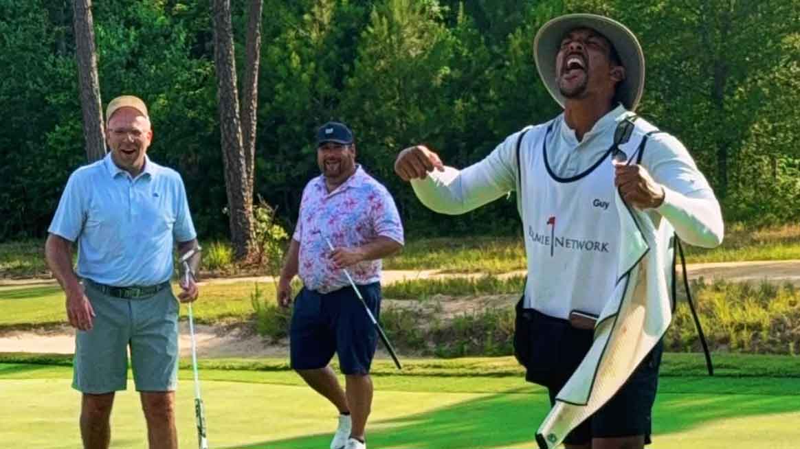 They asked their caddie to hit a shot. He delivered swing of a lifetime