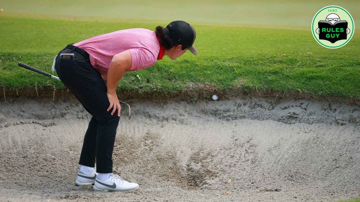 Can you remove a ball from a plugged lie in a bunker to identify it?